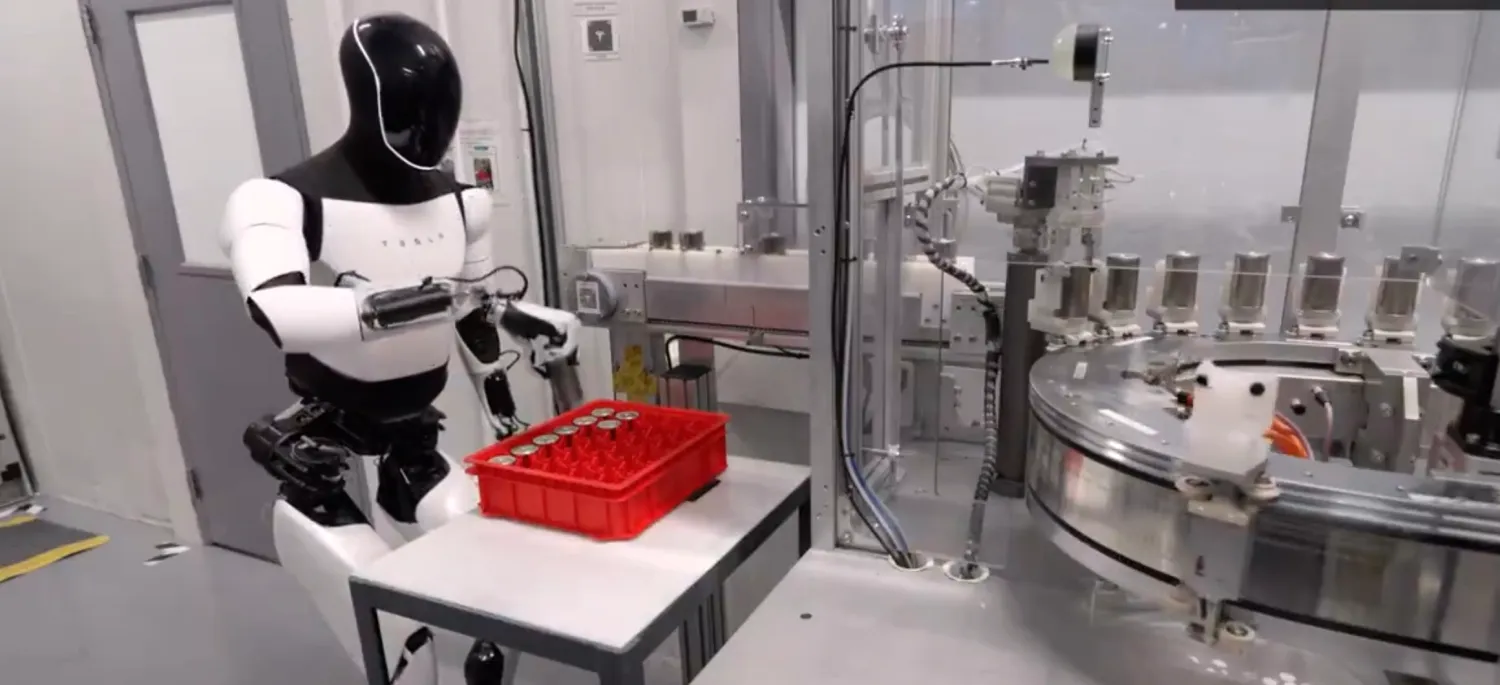 Tesla releases new Optimus humanoid robot video that creates ...